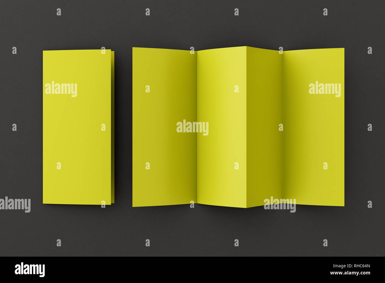 Blank yellow folded paper leaflet on black background. Eight pages ...