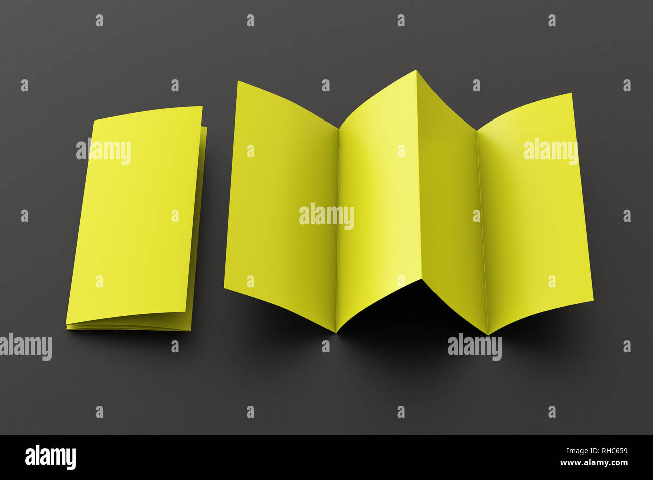 Blank yellow folded paper leaflet on black background. Eight pages ...