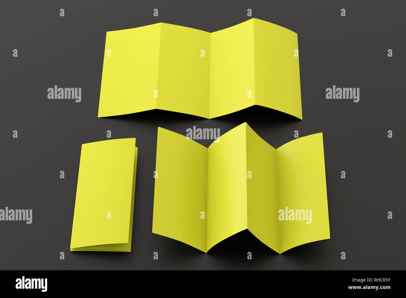 Blank yellow folded paper leaflet on black background. Eight pages ...