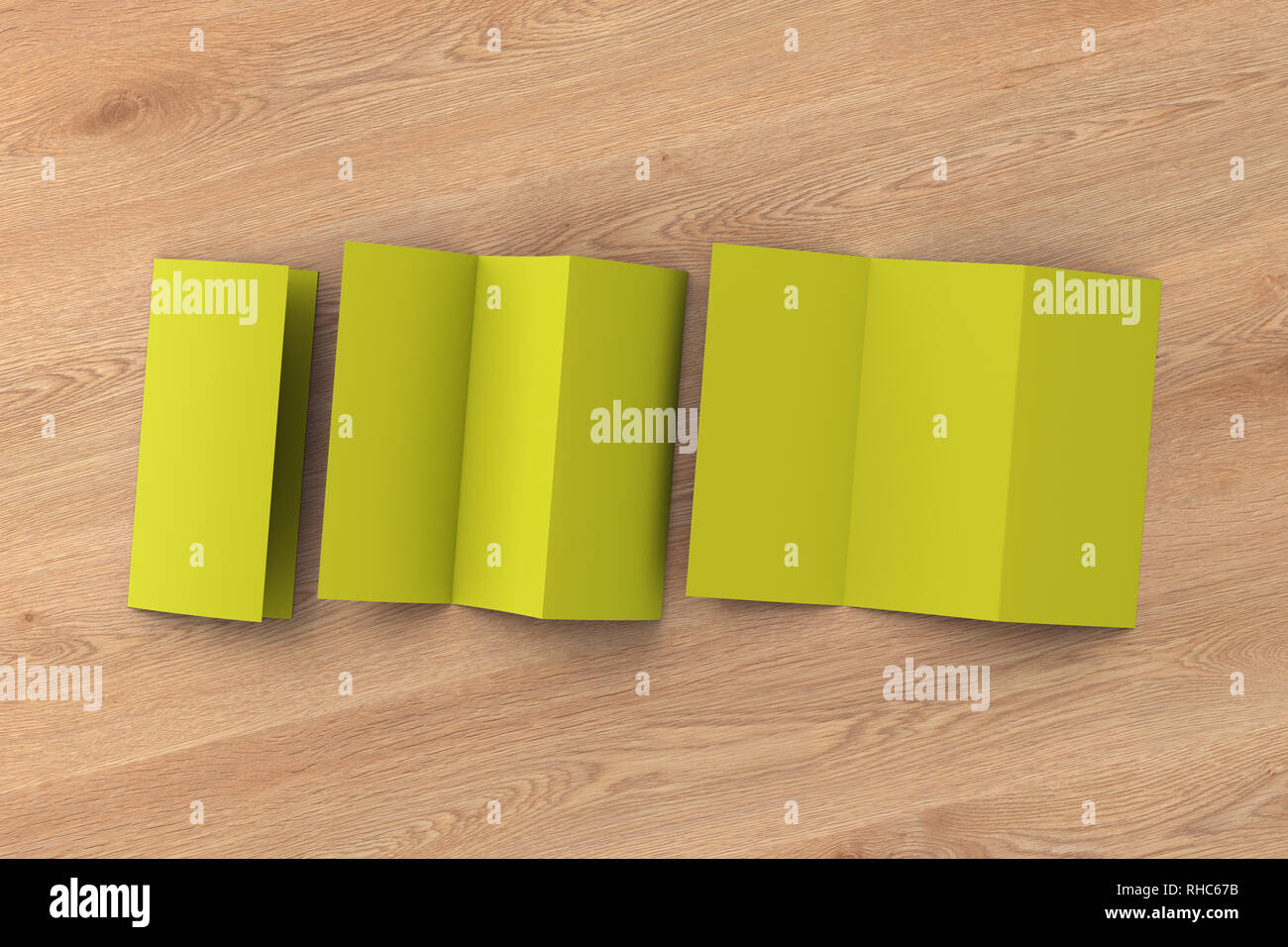 Blank yellow trifold paper leaflet on wooden background. Six pages ...