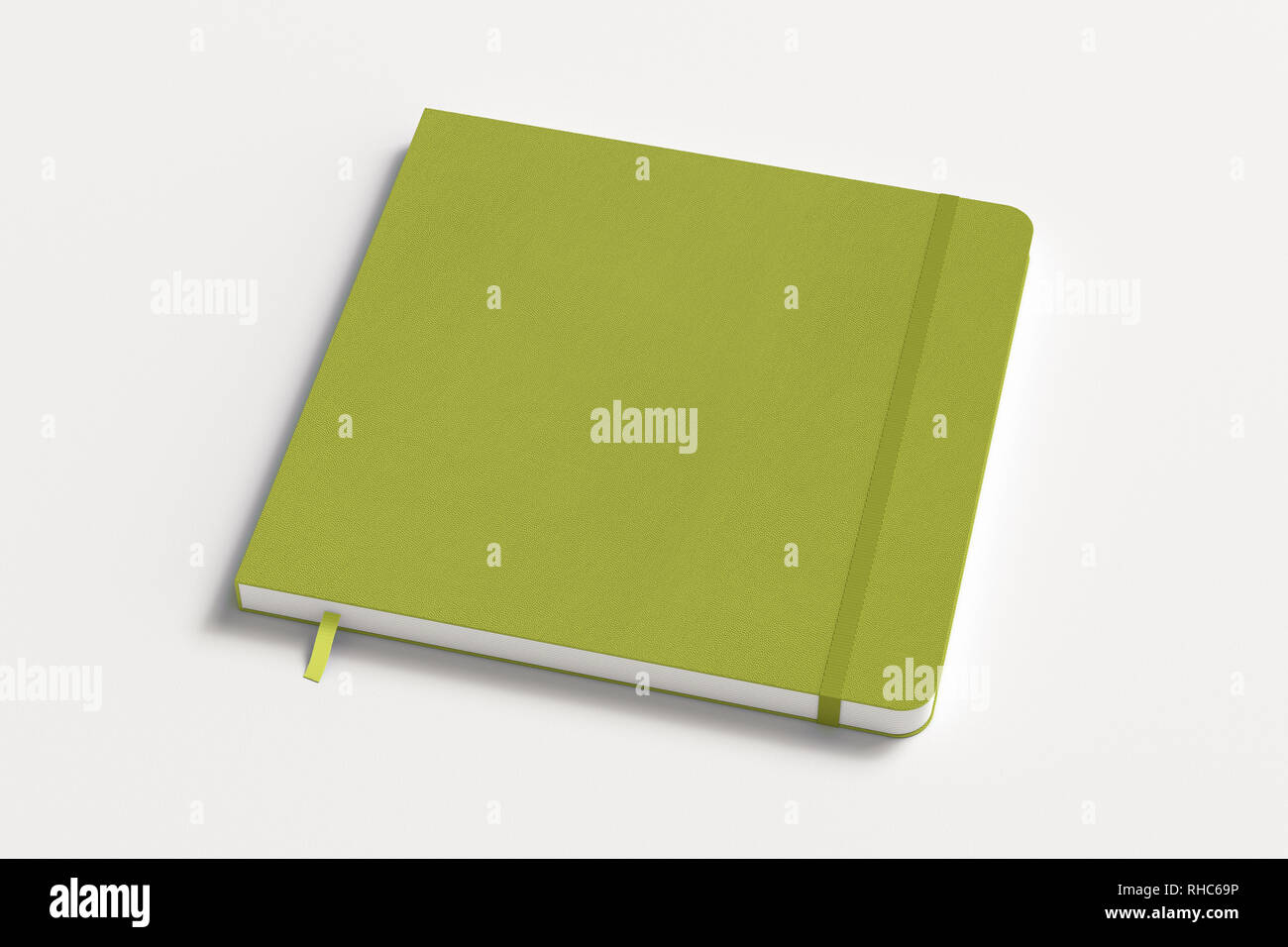 Yellow square notebook with elastic band on white background Stock ...