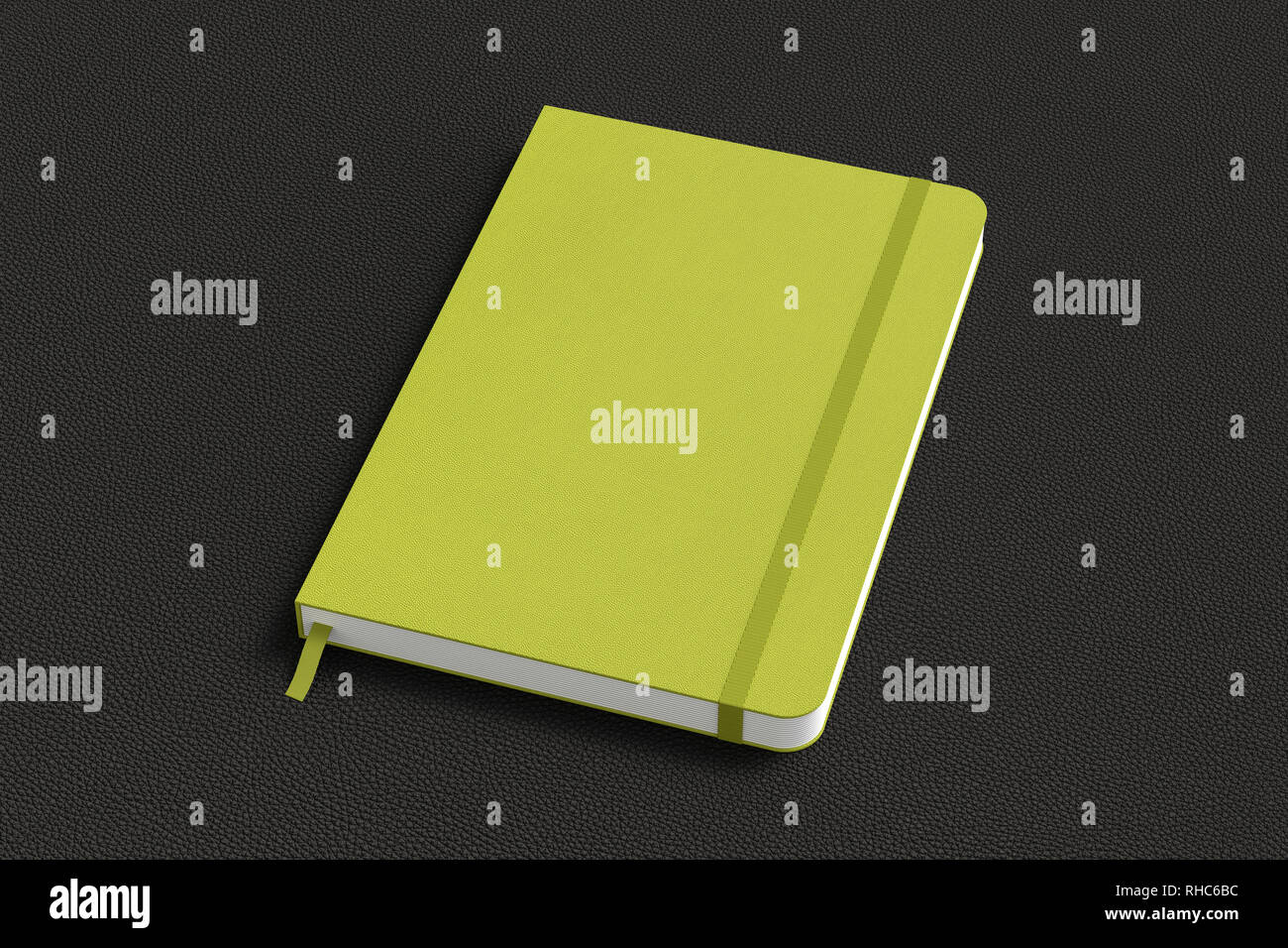 Yellow vertical notebook with elastic band on black background Stock ...