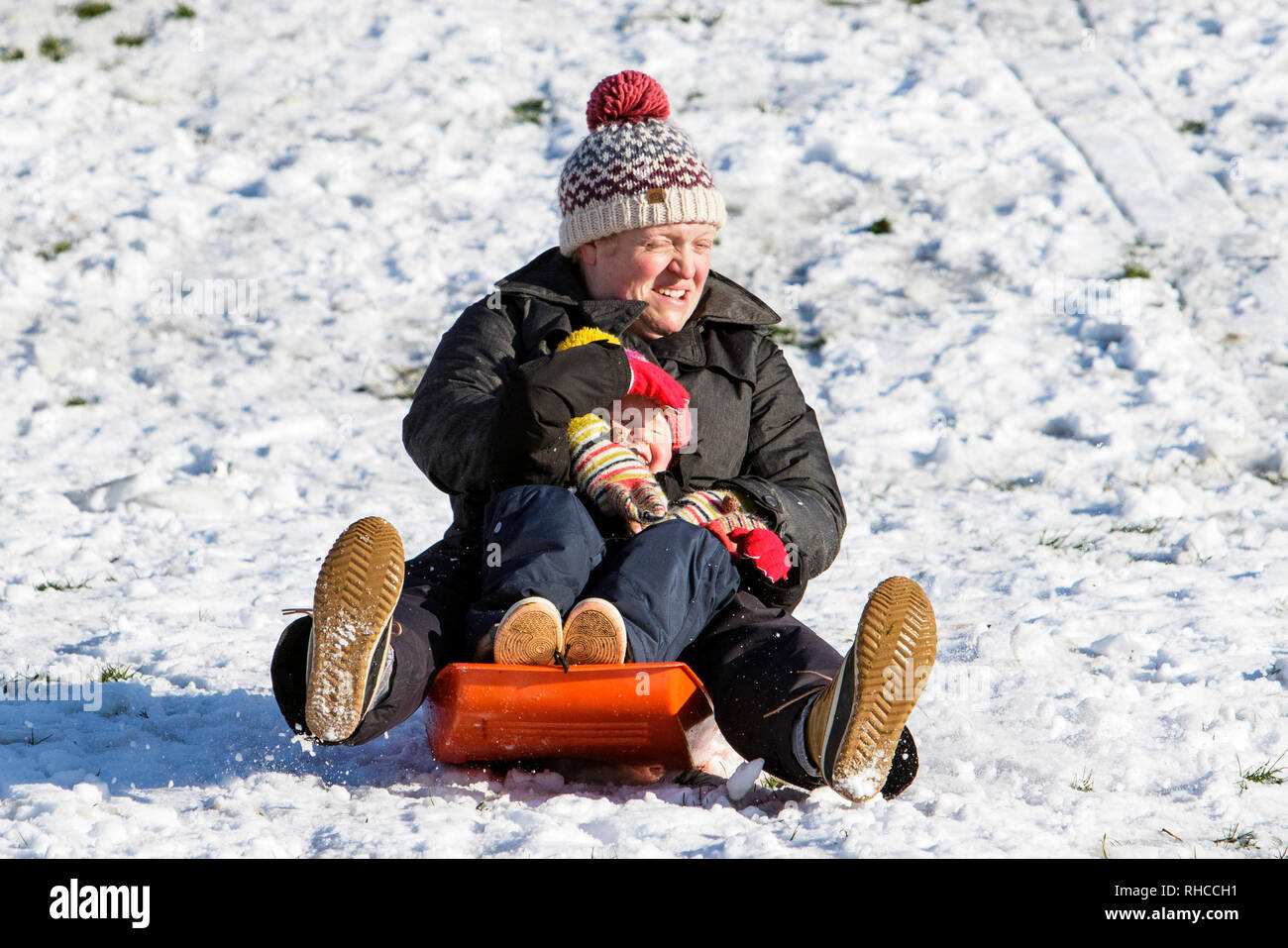 Chippenham, Wiltshire, UK. 2nd February, 2019. A parent and a child ...