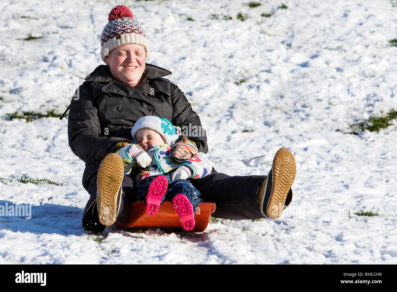 Chippenham, Wiltshire, UK. 2nd February, 2019. A parent and a child ...