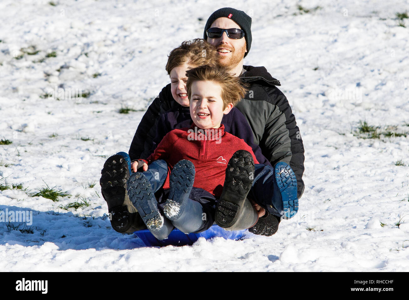 Child girl people person riding sledge sliding snow hi-res stock ...