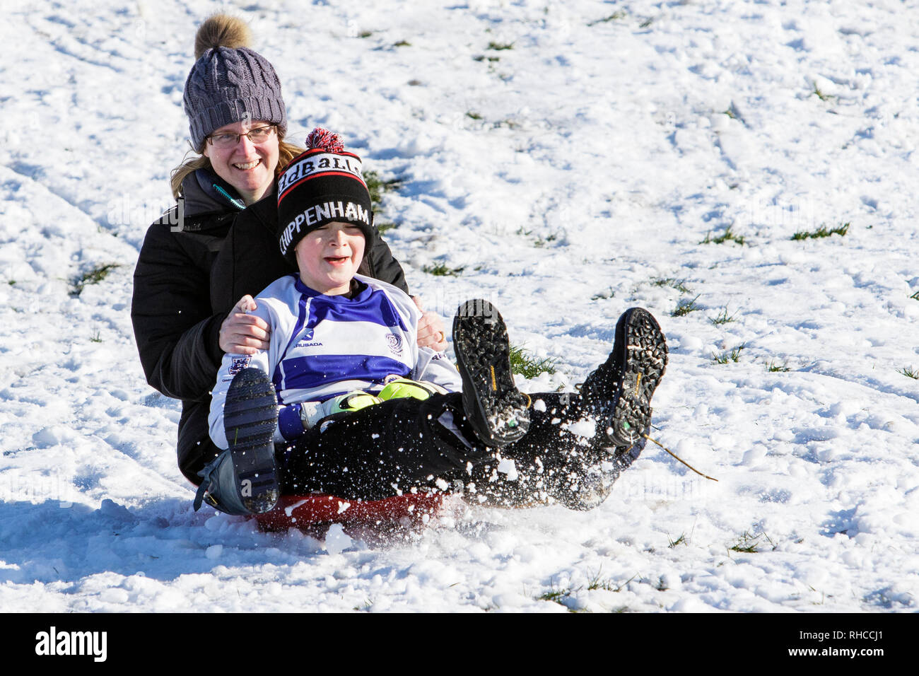 Child girl people person riding sledge sliding snow hi-res stock ...