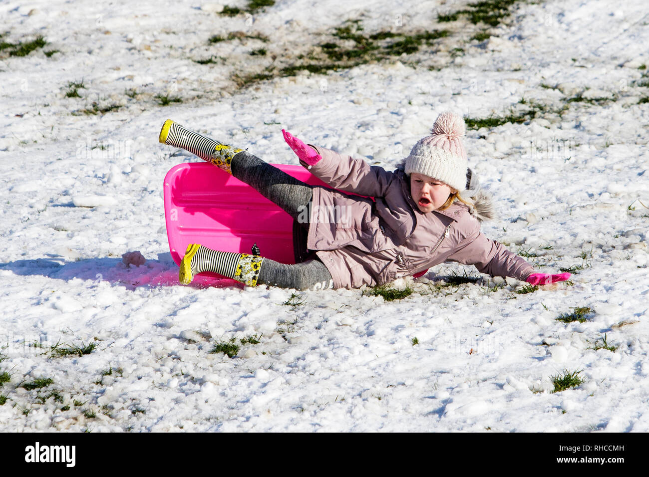 Child girl people person riding sledge sliding snow hi-res stock ...