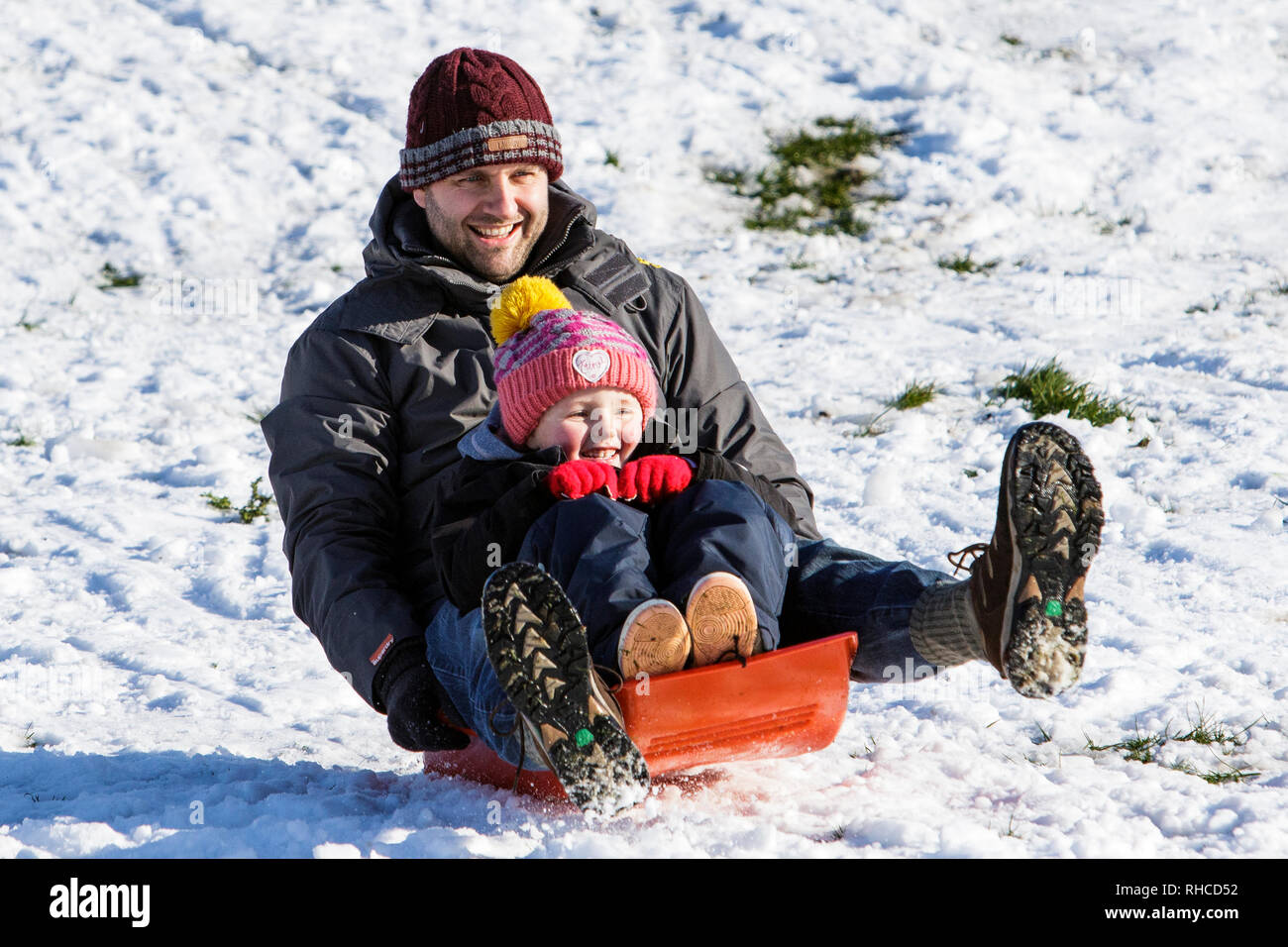 Child girl people person riding sledge sliding snow hi-res stock ...