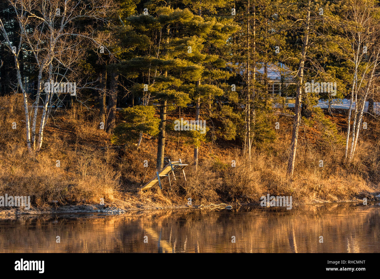 Early morning sunrise on the Chippewa river in northern Wisconsin. A ...