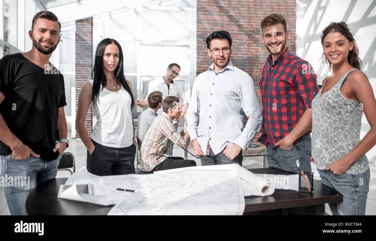 group of designers standing in a modern office Stock Photo - Alamy