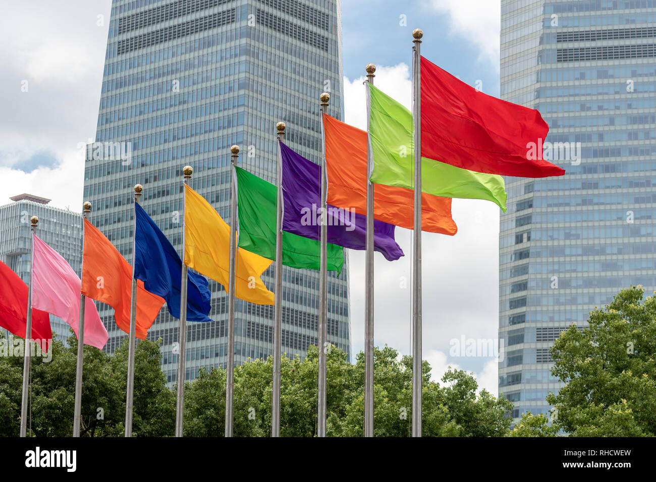 Various single-colour flags flyig from a series of flag poles in ...