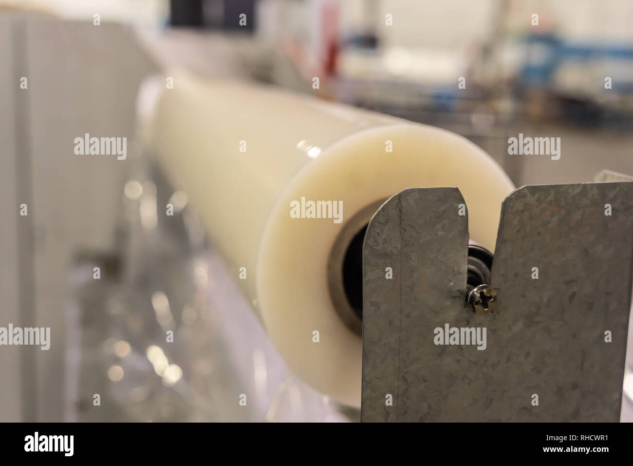 Roll of plastic wrapping material in factory workshop packaging Stock ...