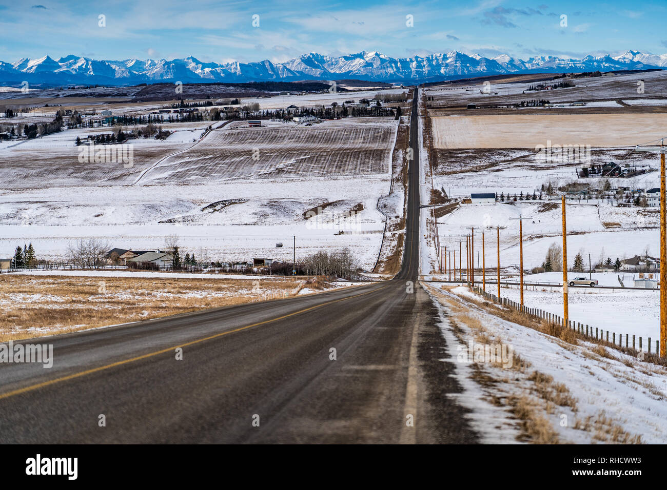 Rural road running through a farm landscape Stock Photo - Alamy
