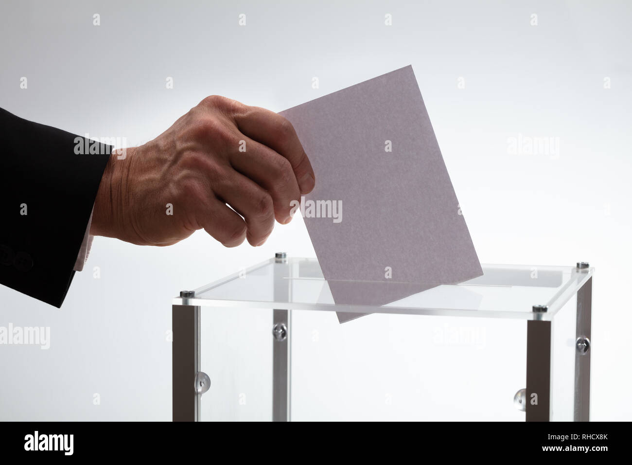 Close-up Of Businessman's Hand Inserting Ballot In A Glass Box Stock ...