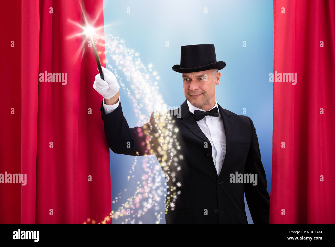 Happy Mature Magician Wearing Black Hat Doing Magic With Illuminated ...
