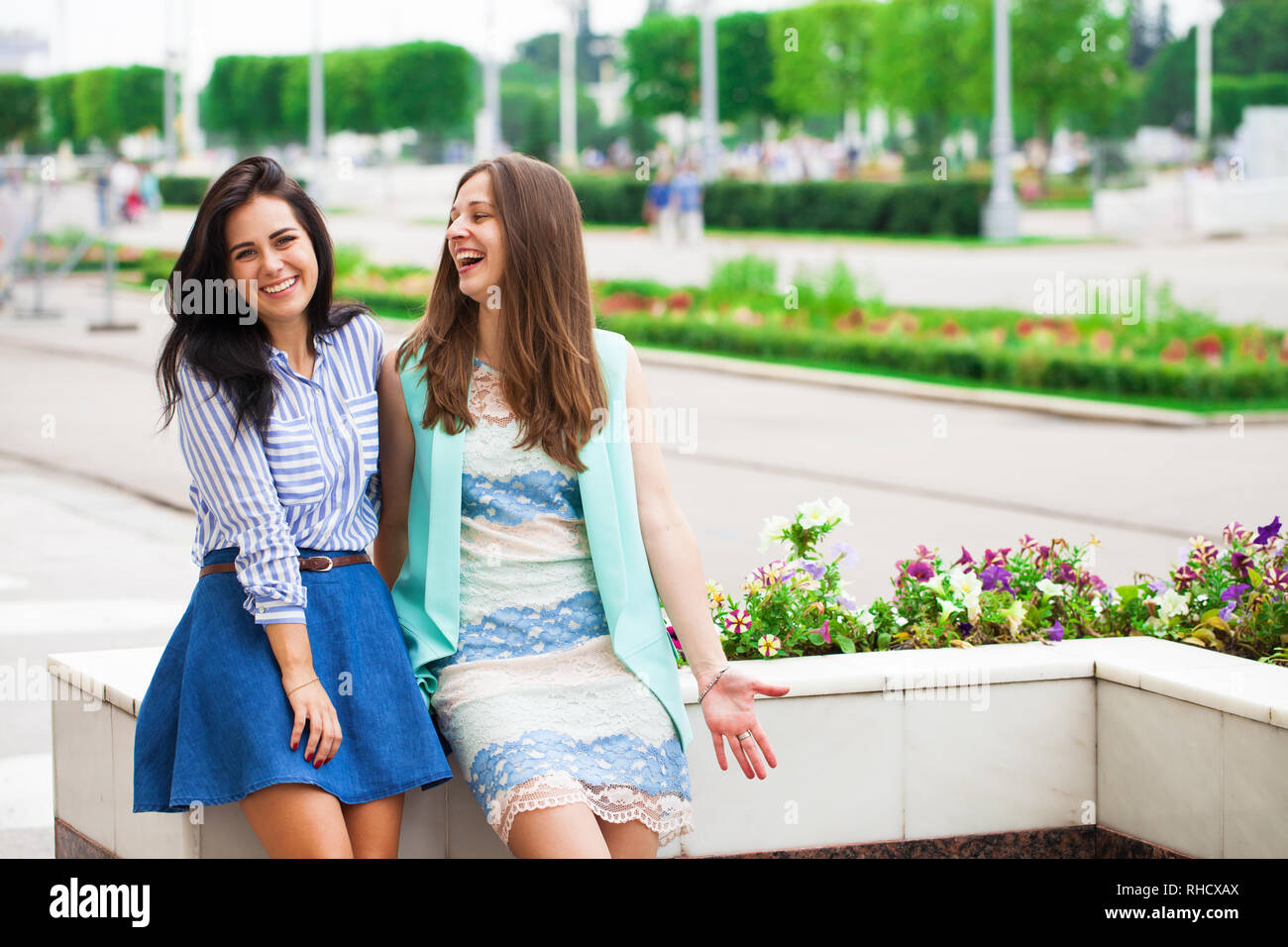 Two young women talking to each other. Girl friends having a chat Stock ...