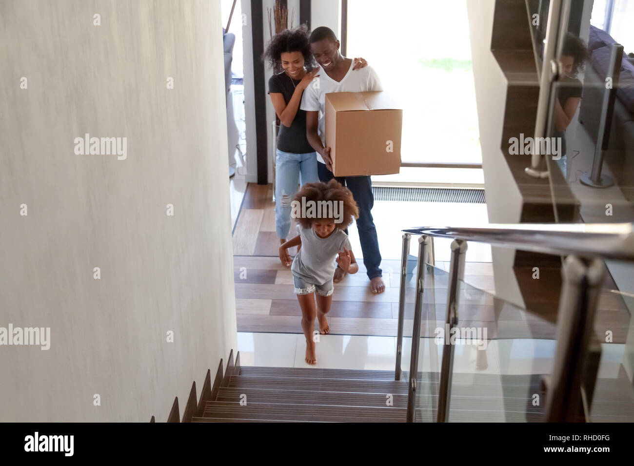 African child exploring new house moving in with parents Stock Photo ...