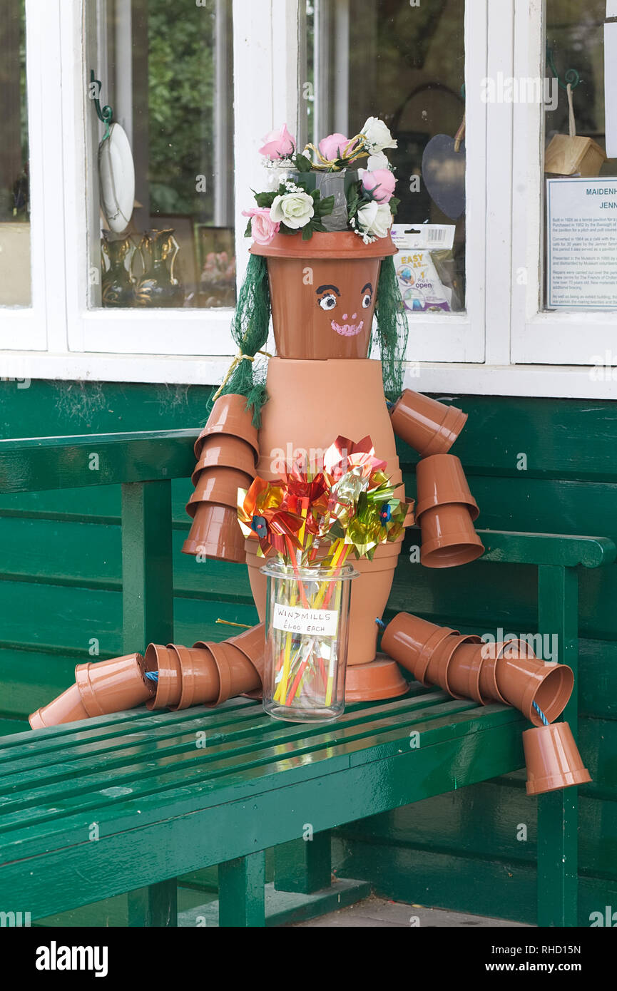 lady made from flower pots Stock Photo - Alamy