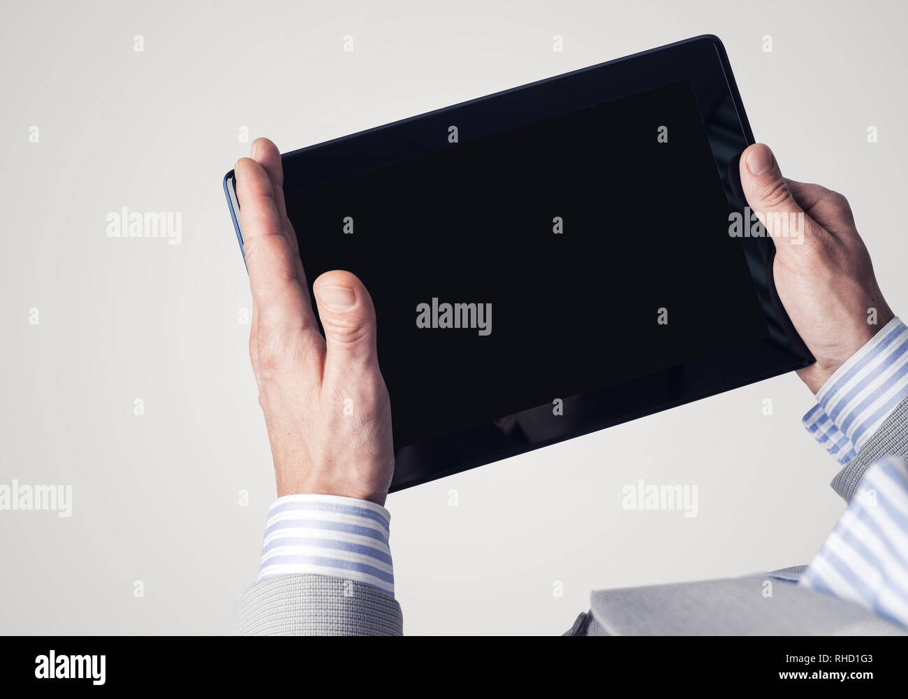 Hands of businessman holding tablet pc with black screen Stock Photo ...