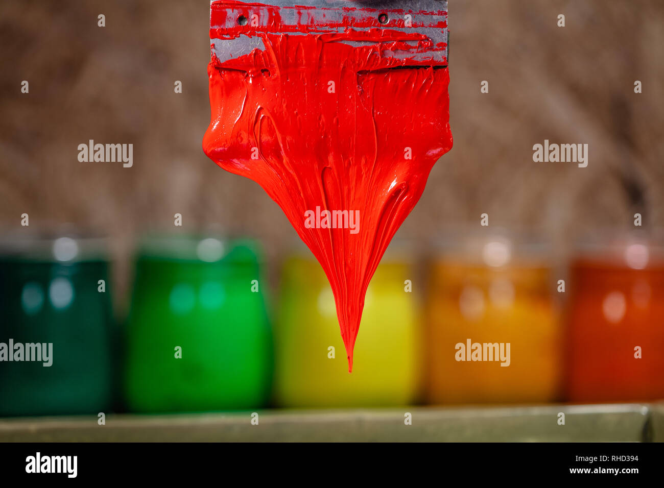 red color dripping from hand screen printing during printing tee shirt ...