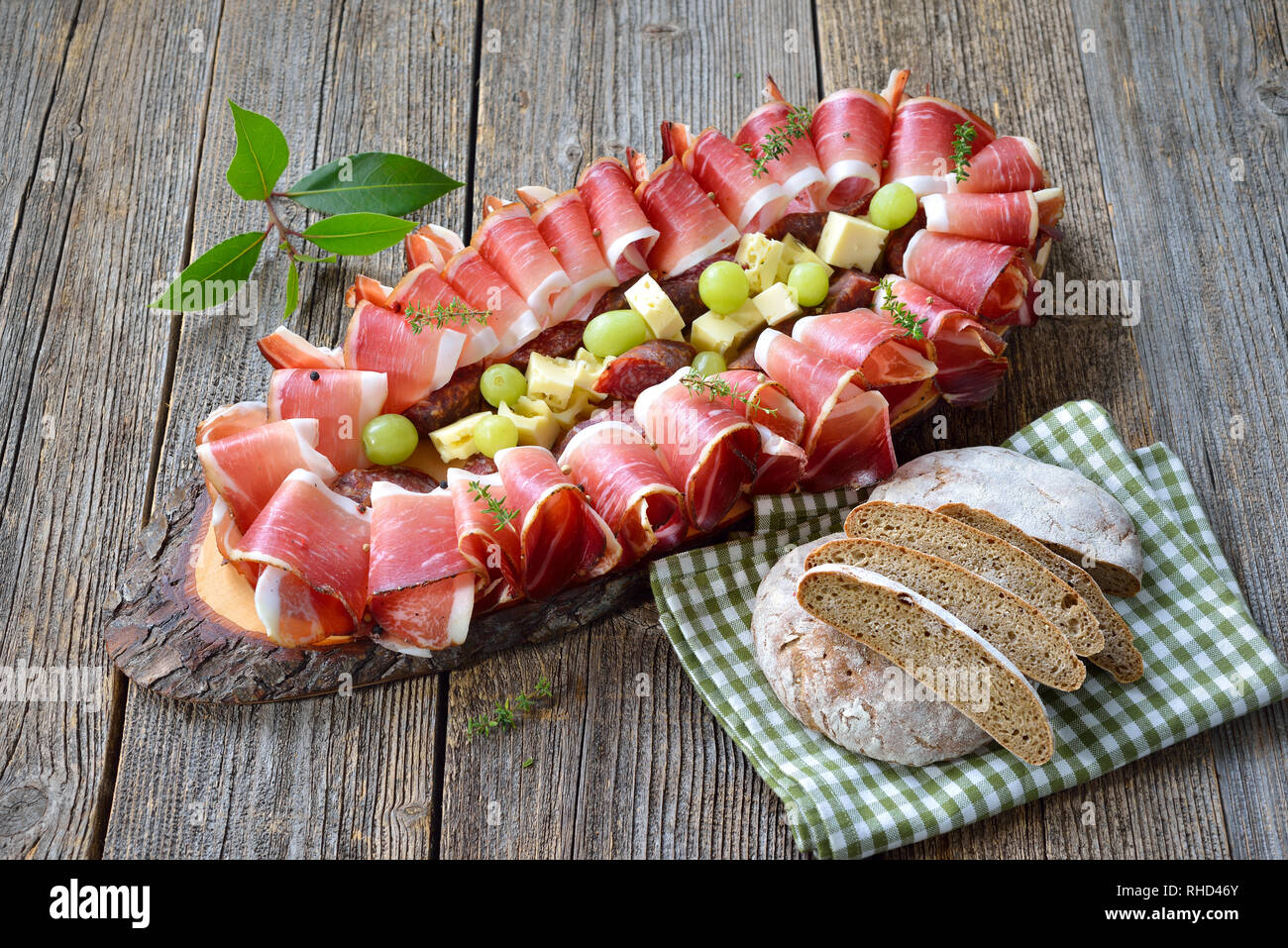 Typical South Tyrolean snack with country bacon, salami and aged ...