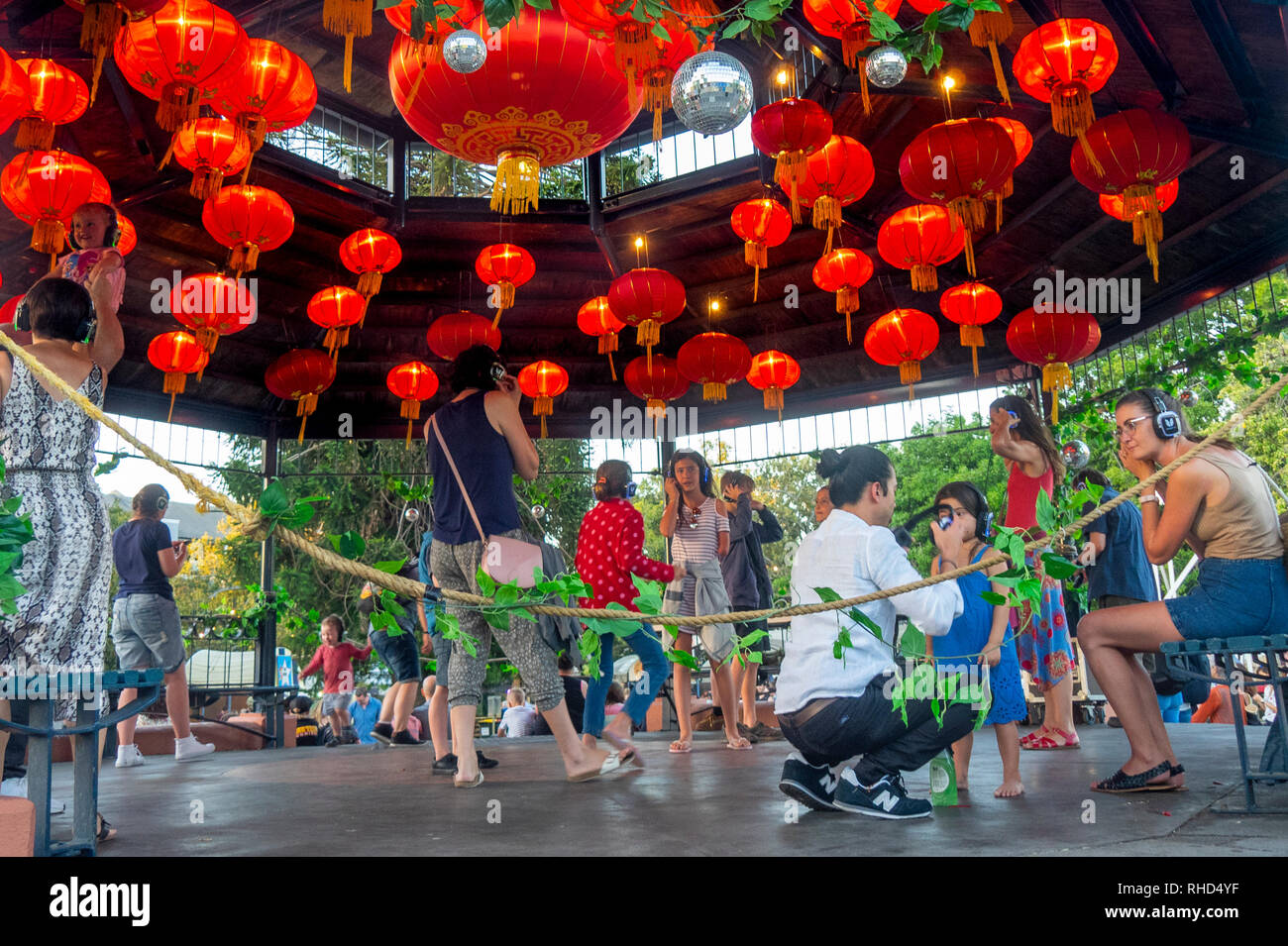 Children dancing in a silent disco while their parents watch in the ...