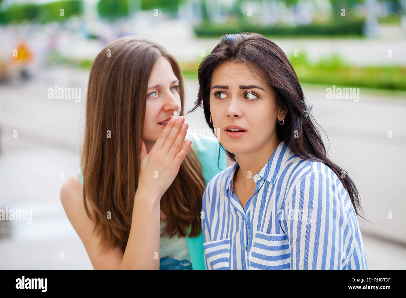 Two young women talking to each other. Girl friends having a chat Stock ...