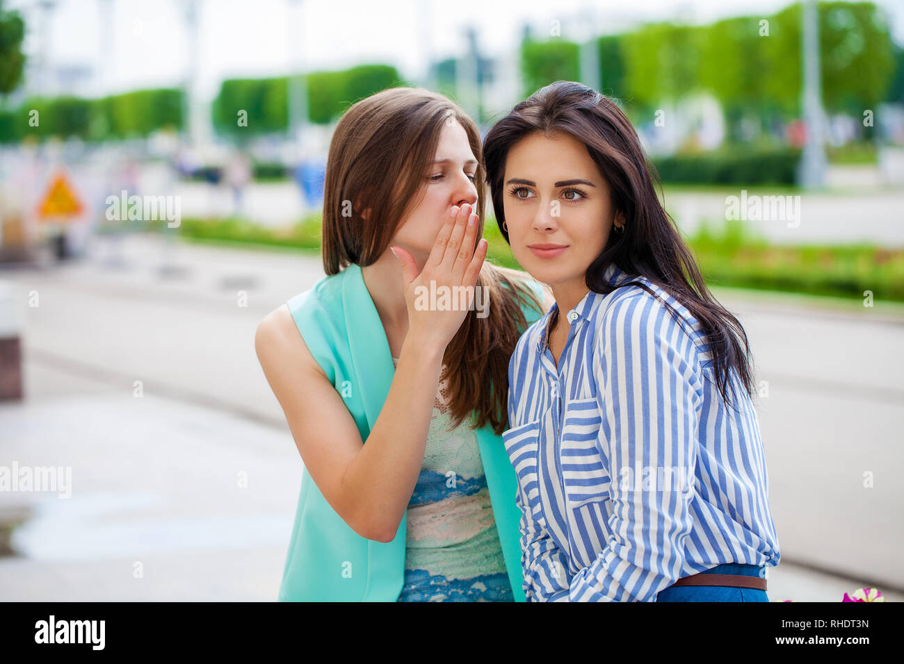 Two young women talking to each other. Girl friends having a chat Stock ...