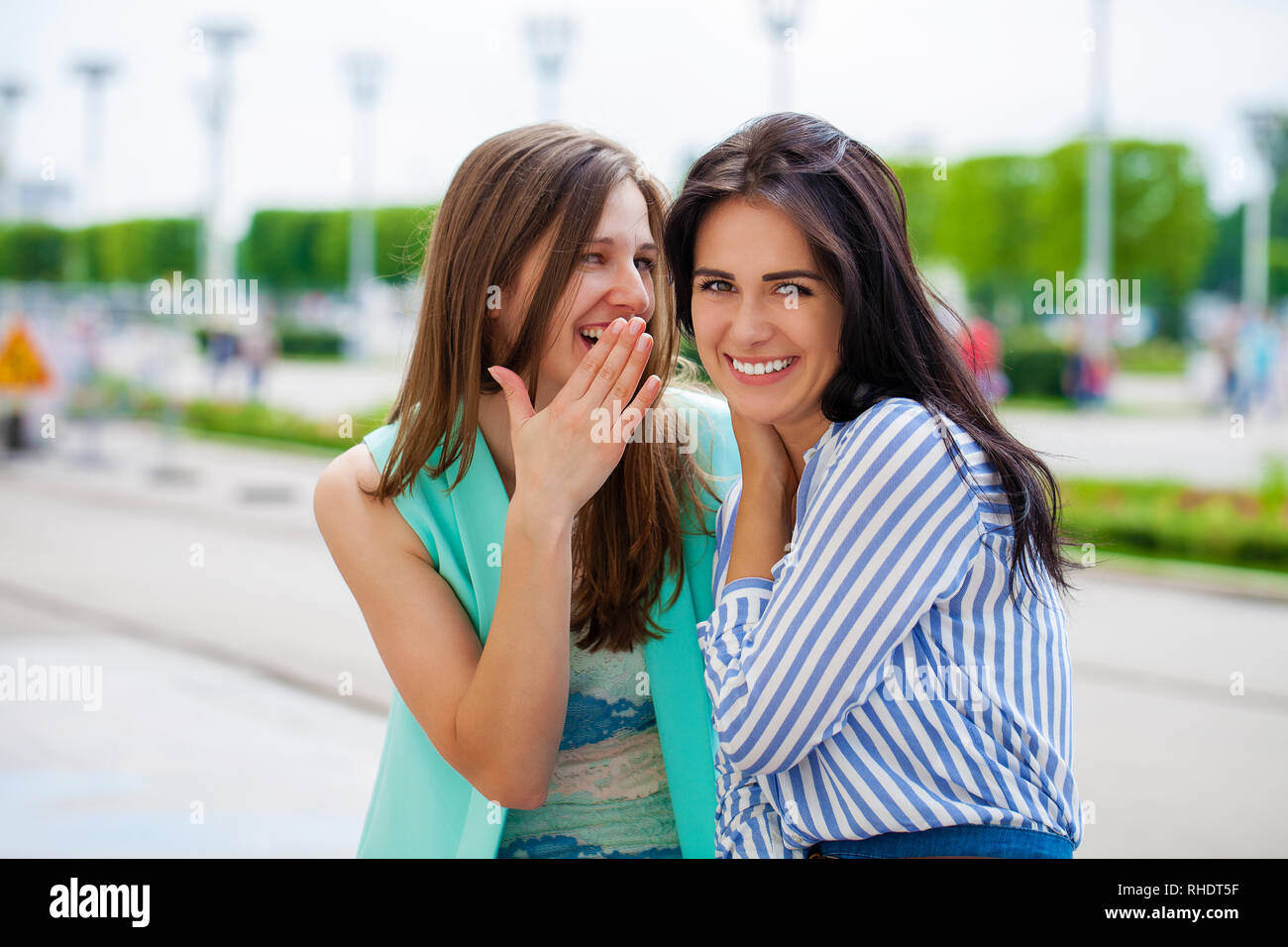 Two young women talking to each other. Girl friends having a chat Stock ...
