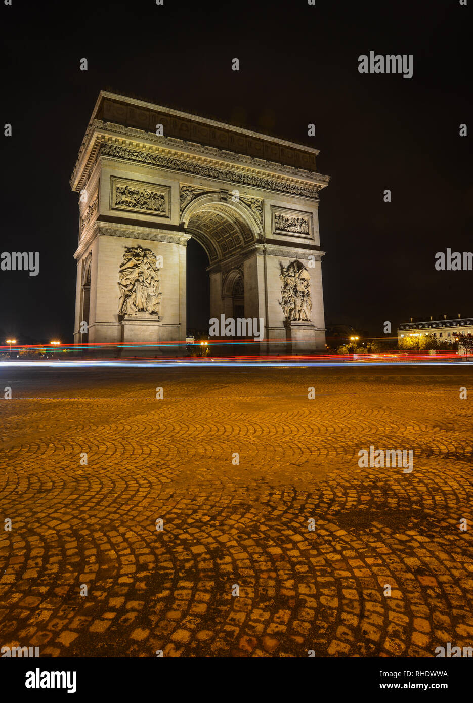 The Triumphal Arch at evening in Paris, France. Arc de Triomphe was ...