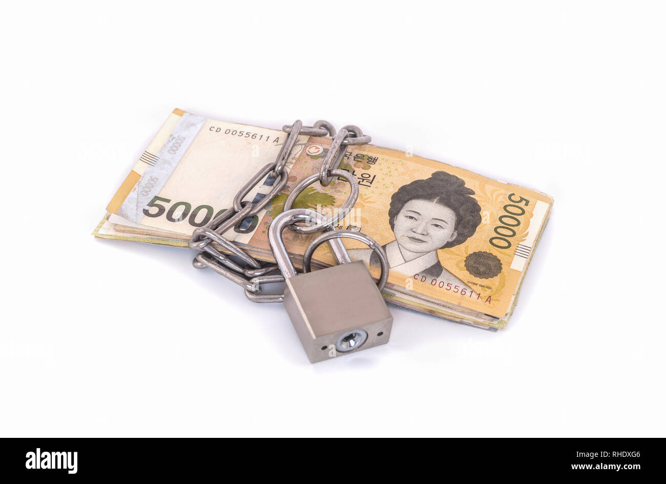 Won bank notes with a lock and chain. Money stack for safety and ...