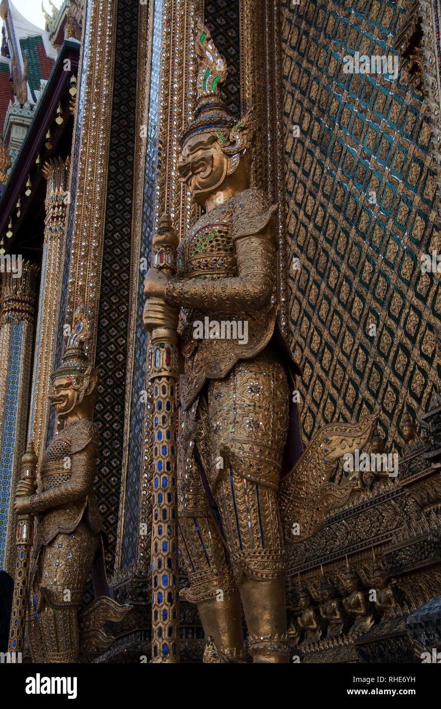 Bangkok Thailand, guardian at the entrance to ornate temple building ...