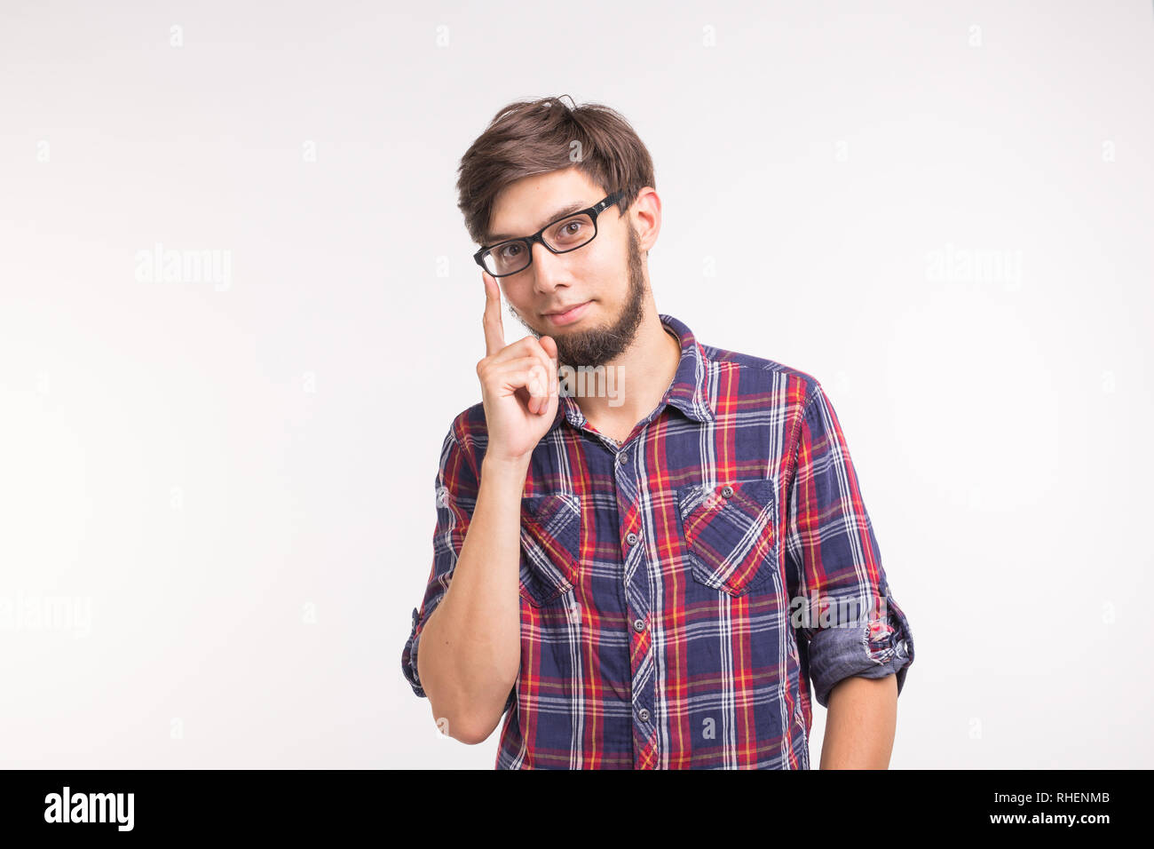 Casual man pointing up his finger on white background. I have an Idea ...