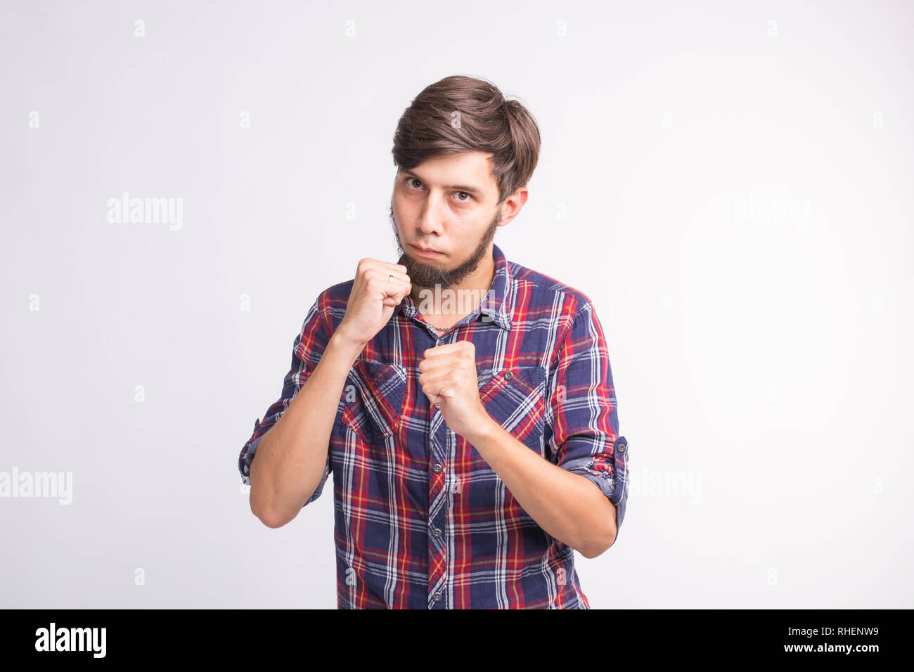 People, gestures and fight concept - young bearded man showing his ...