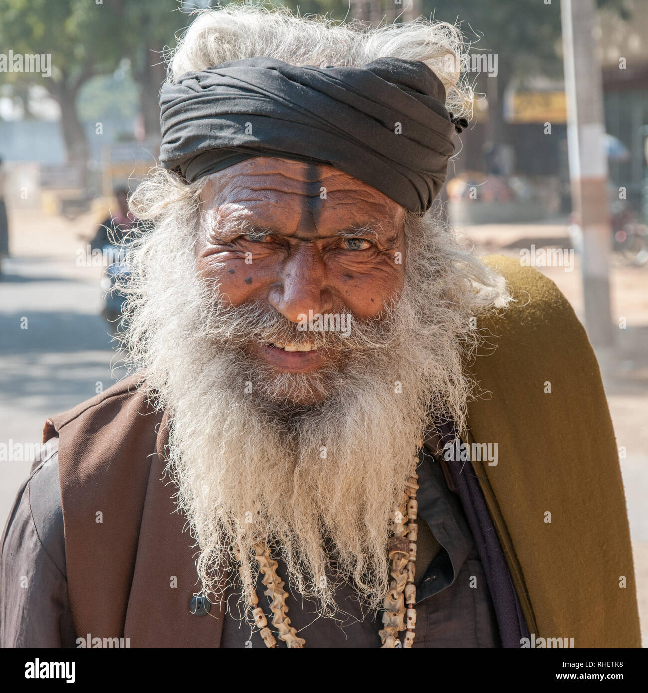 Portrait of a smiling Rajasthani man in Ranthambore. Rajasthani people ...