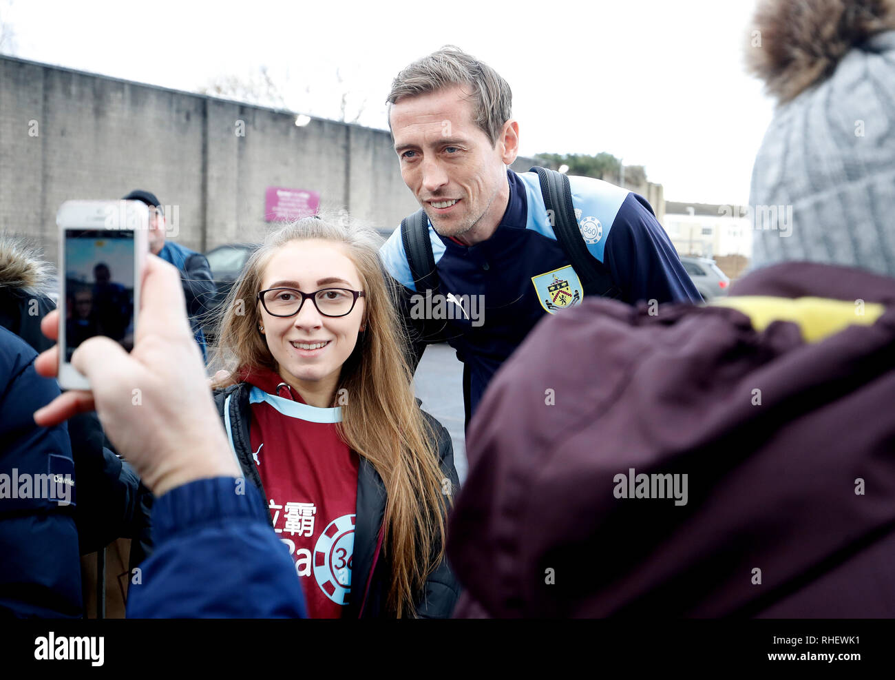 Burnley's Peter Crouch poses for a photograph with a fan outside the ...