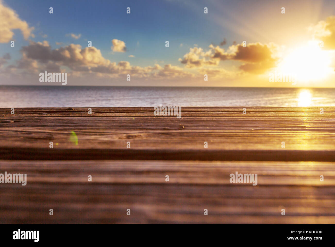 Wooden table with beach background. Travel background Stock Photo - Alamy