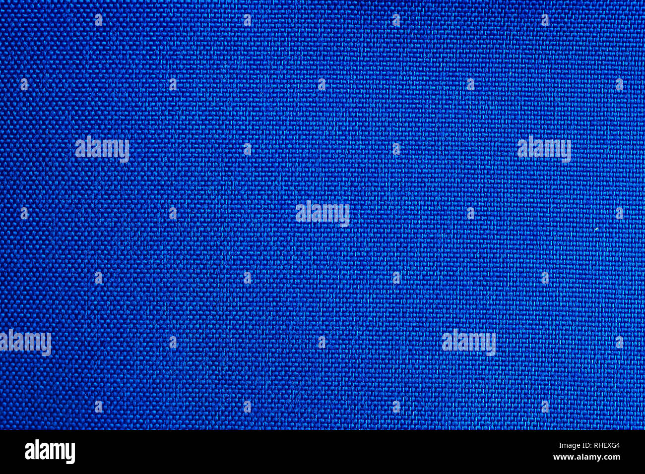 Bright blue color textile fabric surface close up macro texture ...