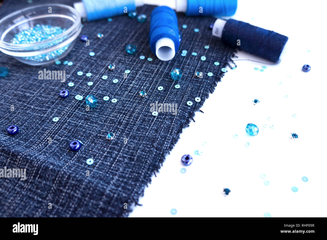A set of materials for needlework in blue color on a white background ...