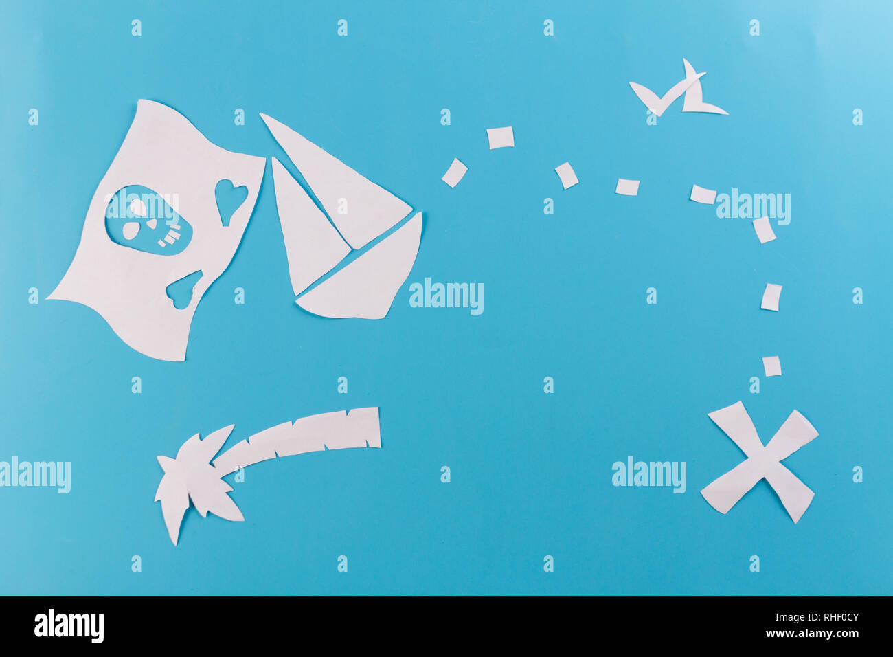 pirate ship concept image. paper cut on blue background Stock Photo - Alamy