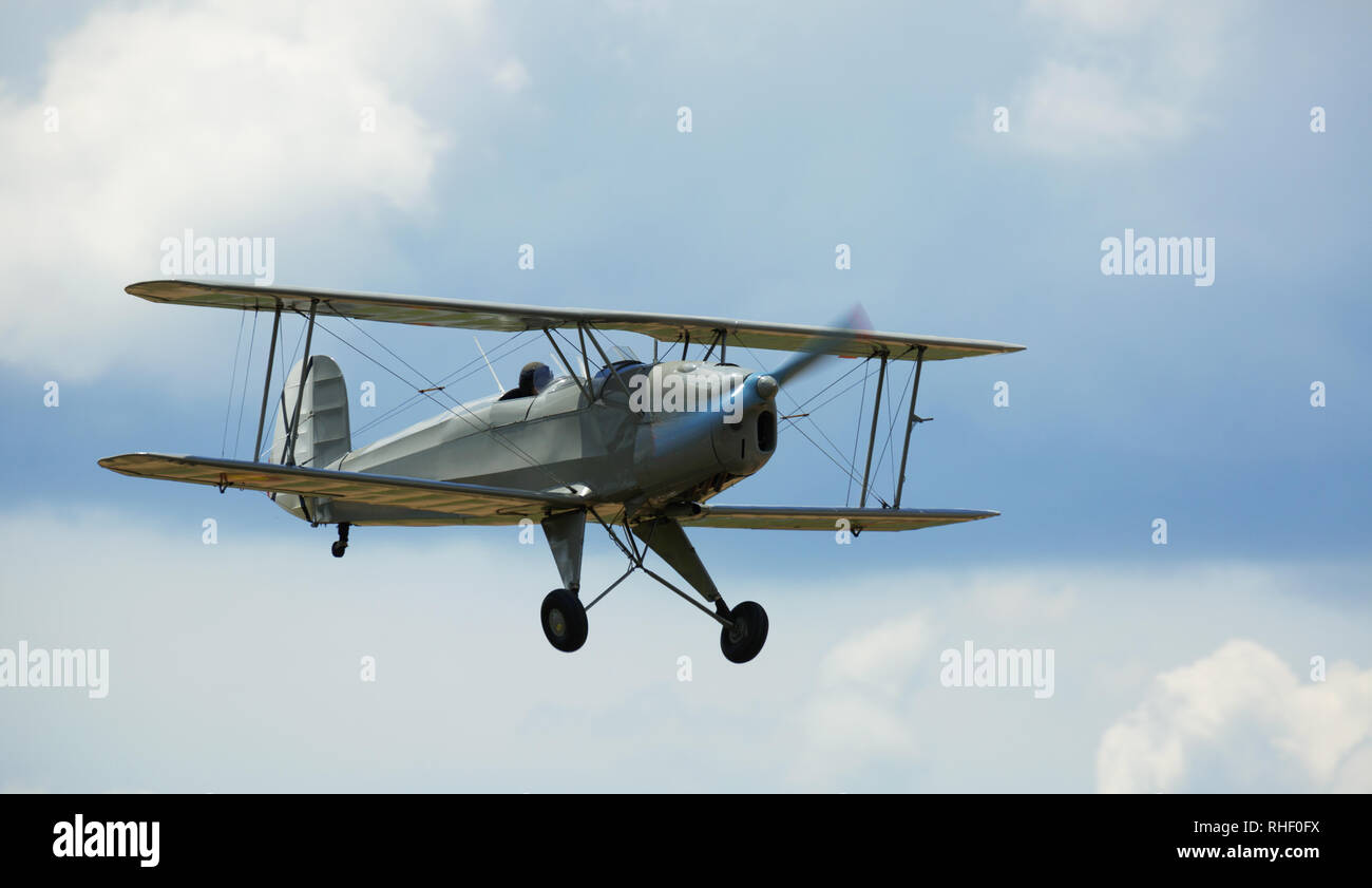 Light biplane demonstrating flying capabilities in sunny sky Stock ...