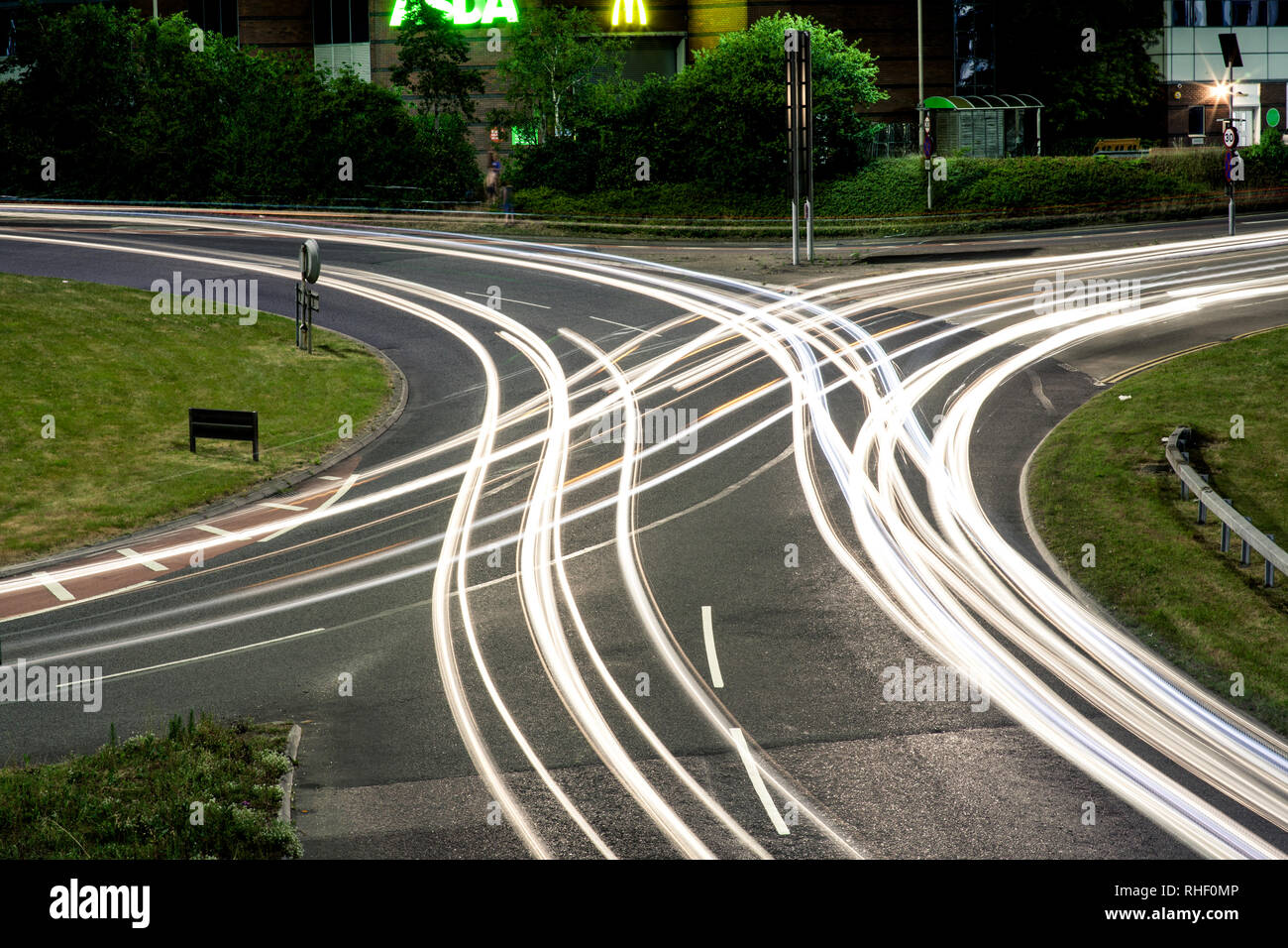 Crisscrossing light trails from cars on a roundabout in Bournemouth ...
