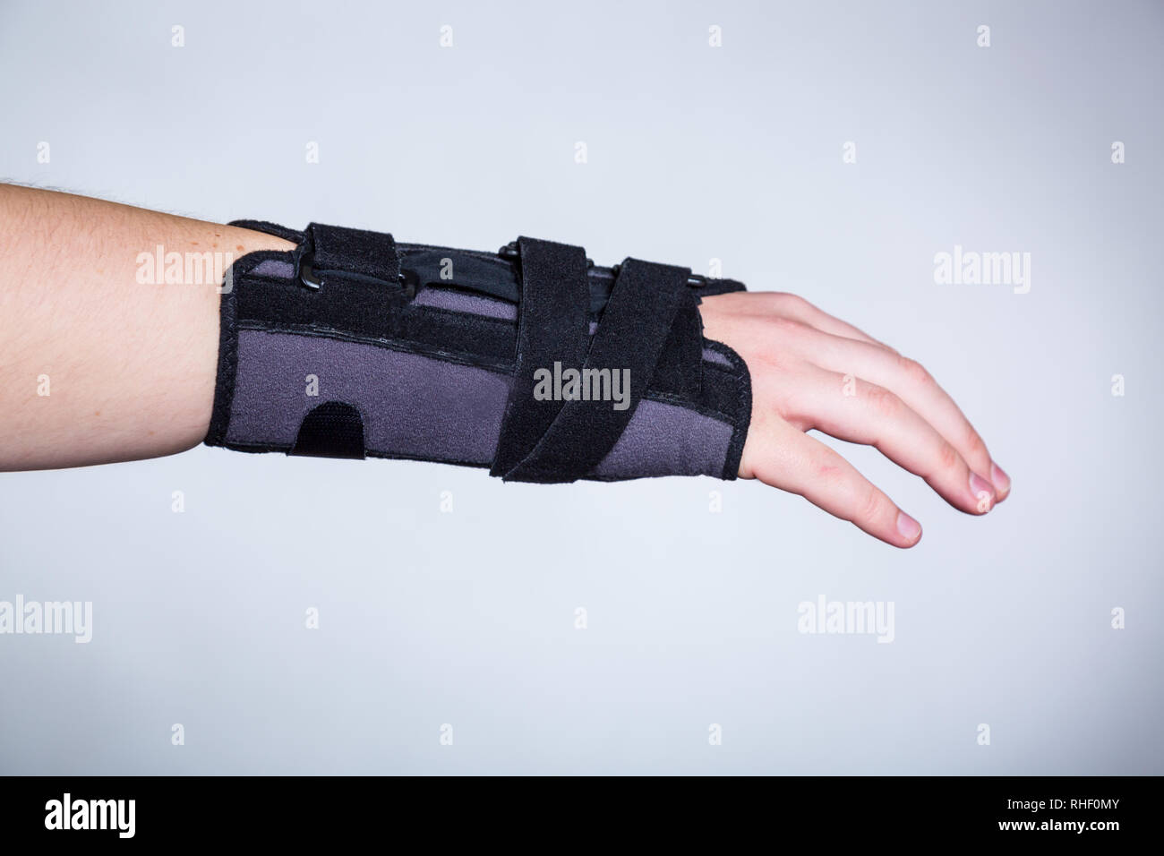 Hand in orthopedic orthosis on white backgroud Stock Photo - Alamy