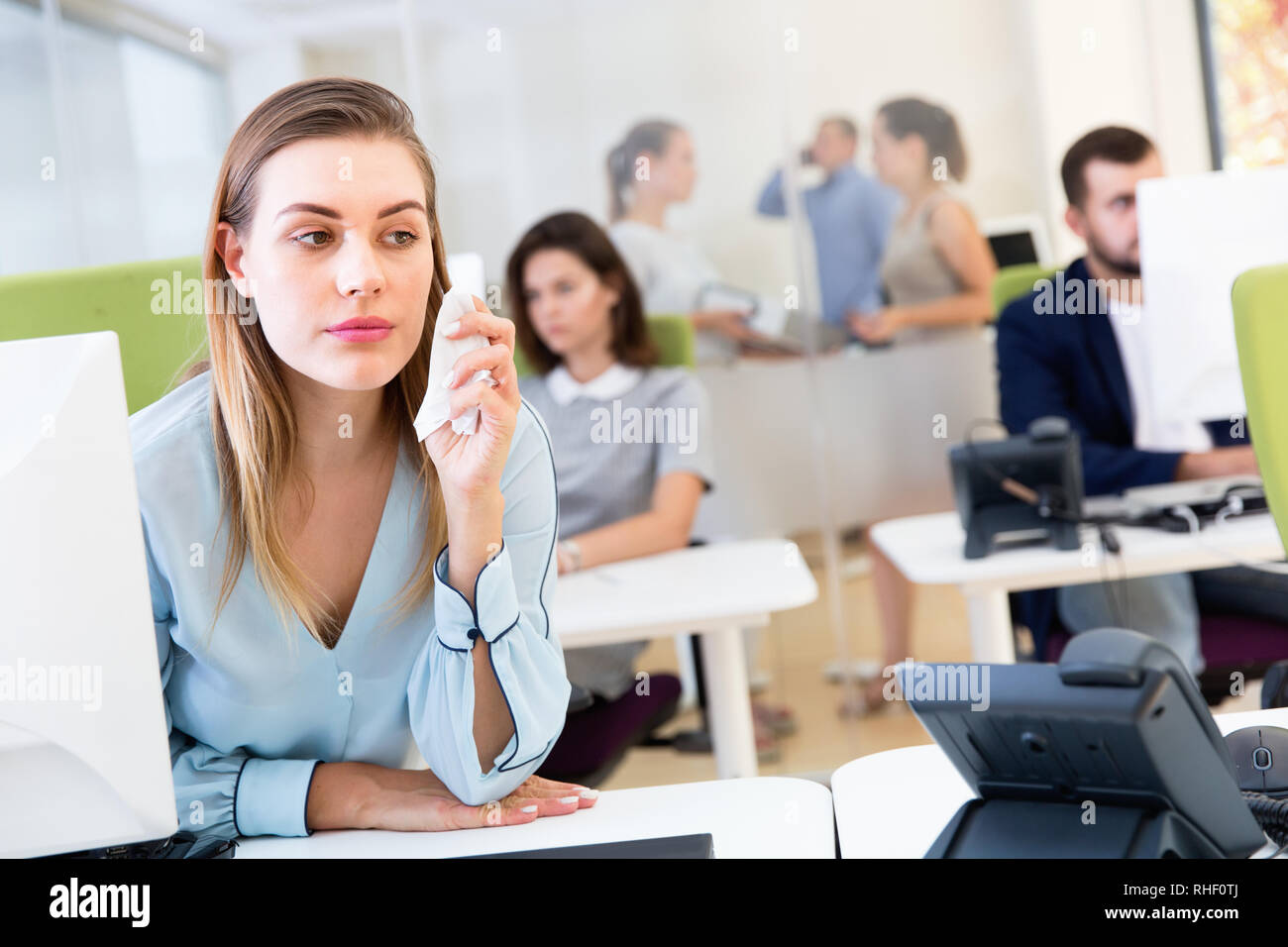 Portrait of frustrated young angry business woman in coworking space ...