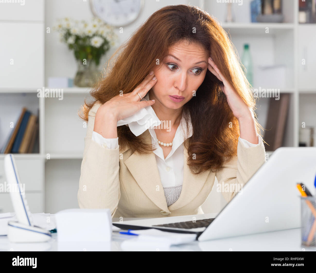 Woman is upset because of complicated issue with project in the office ...