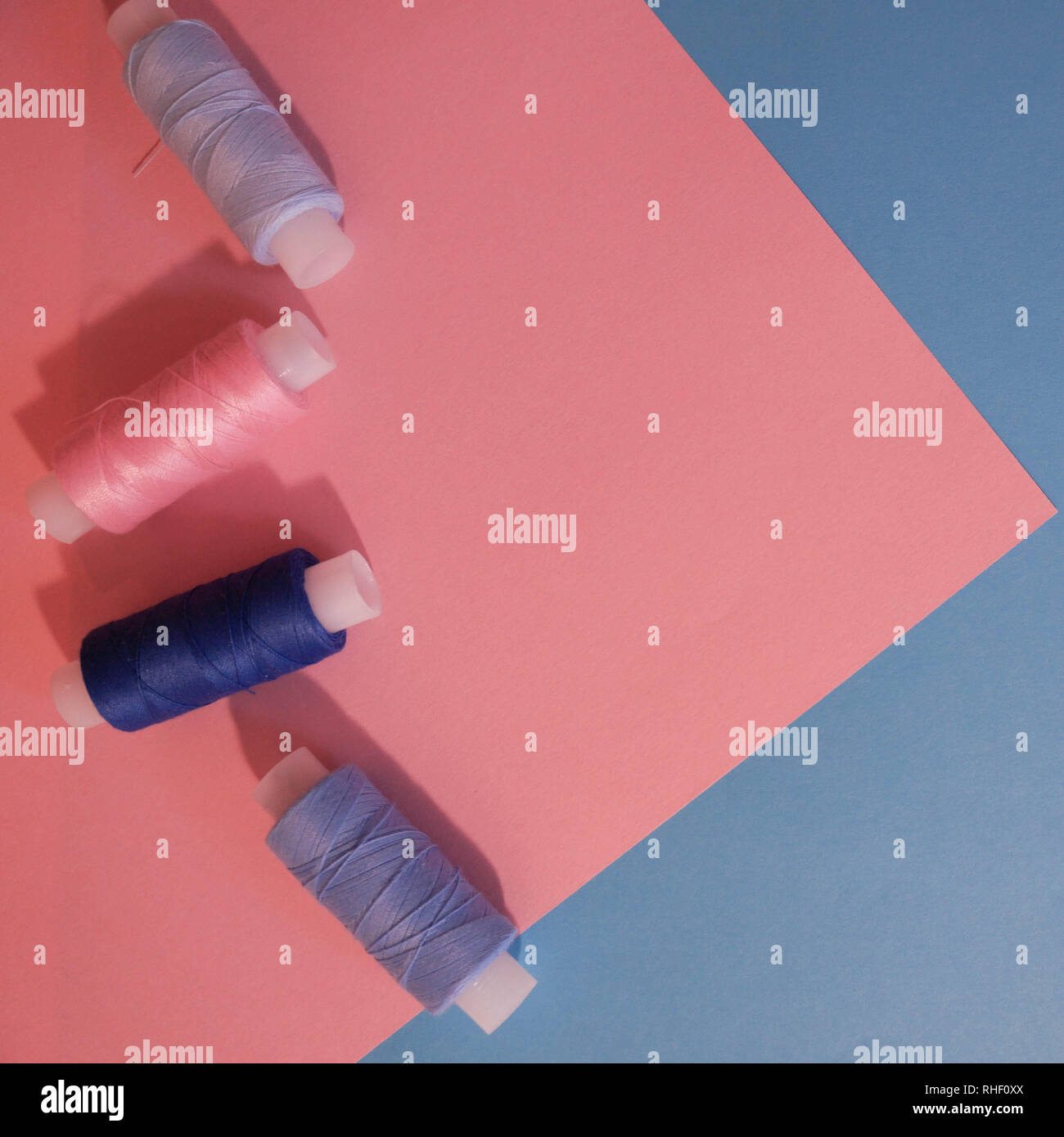 Pastel paper background with threads for design Stock Photo - Alamy