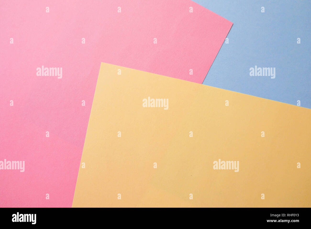 Bright paper background for design. Blue, pink and yellow Stock Photo ...
