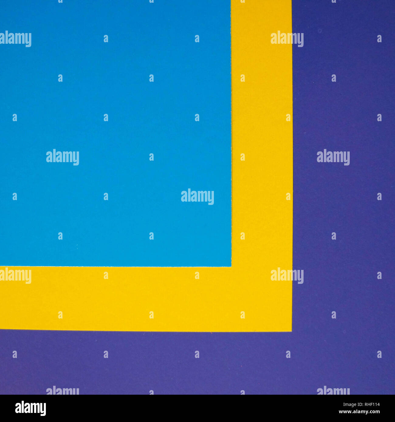 Bright flat lay background with color paper sheets. Yellow and blue ...
