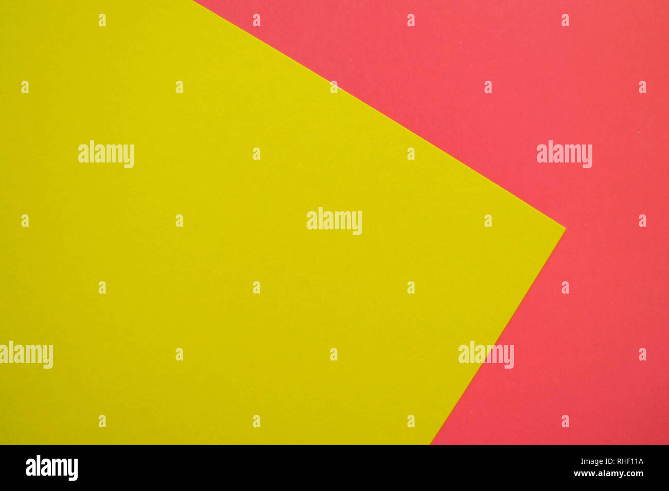 Abstract flat lay background with color paper sheets. Yellow and pink ...