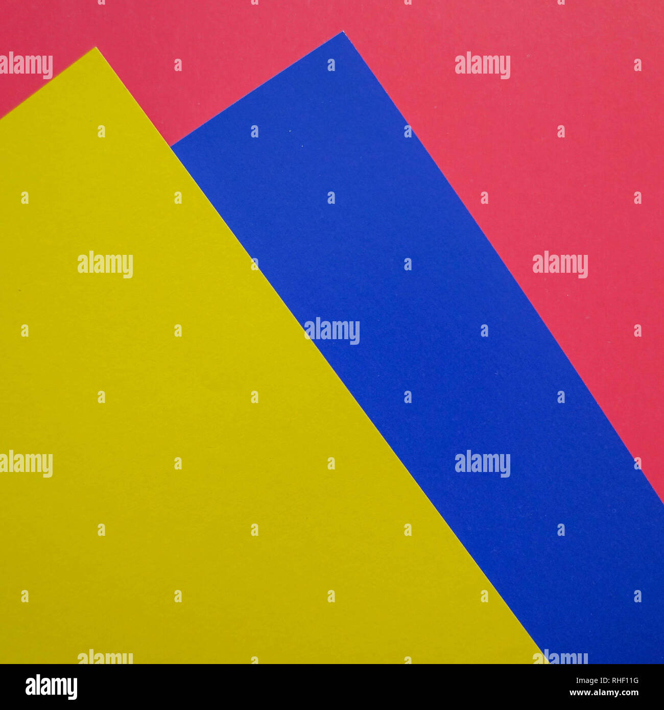 Fashion flat lay background with color paper sheets. Yellow, blue and ...